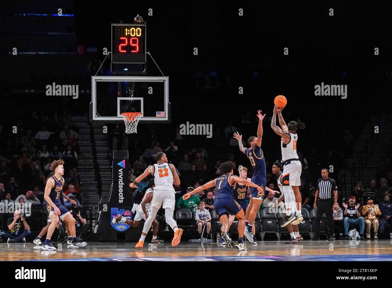 Oklahoma State guard Javon Small (12) shoots over Notre Dame forward ...