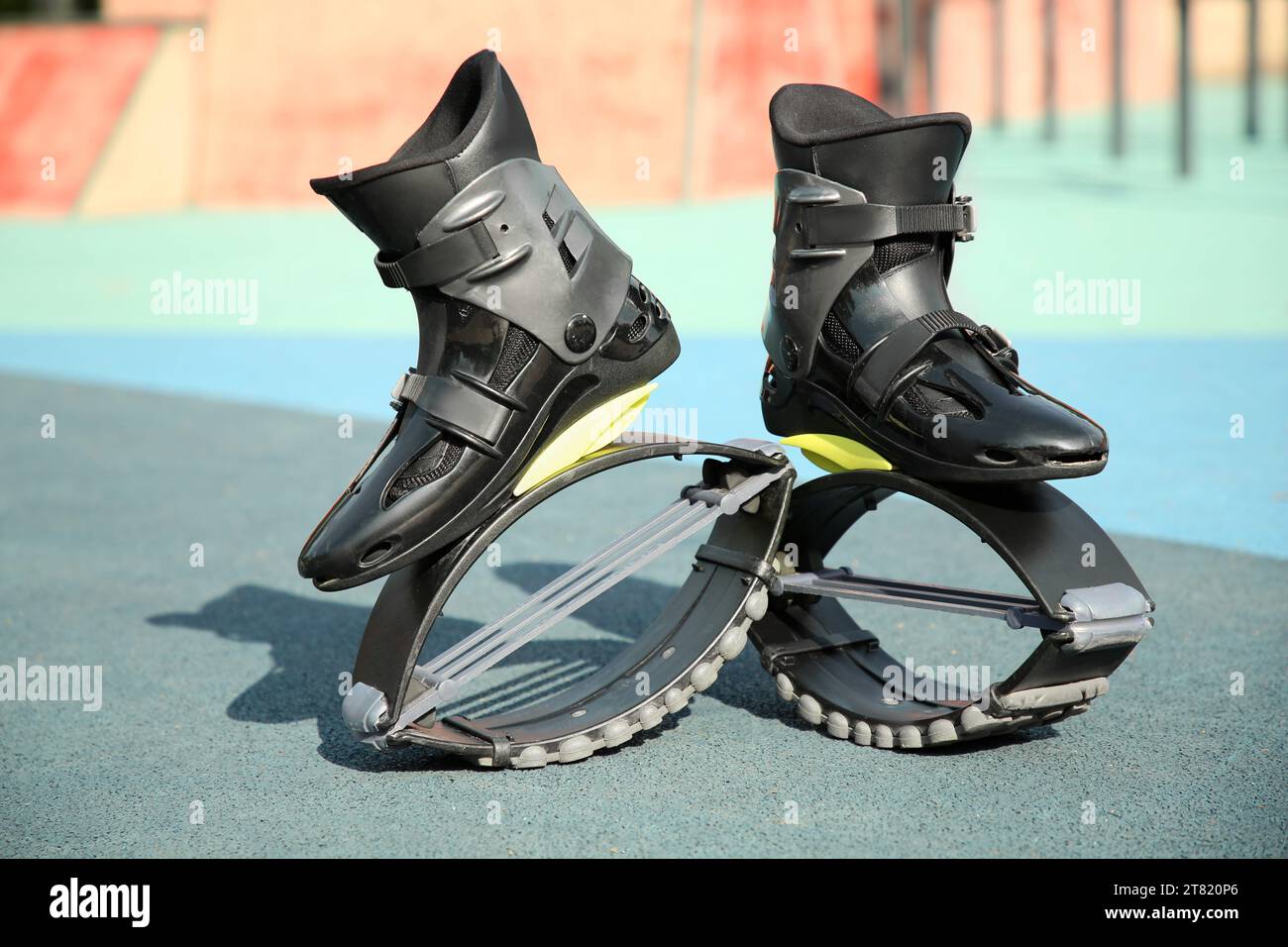 Stylish kangoo jumping boots in workout park Stock Photo - Alamy