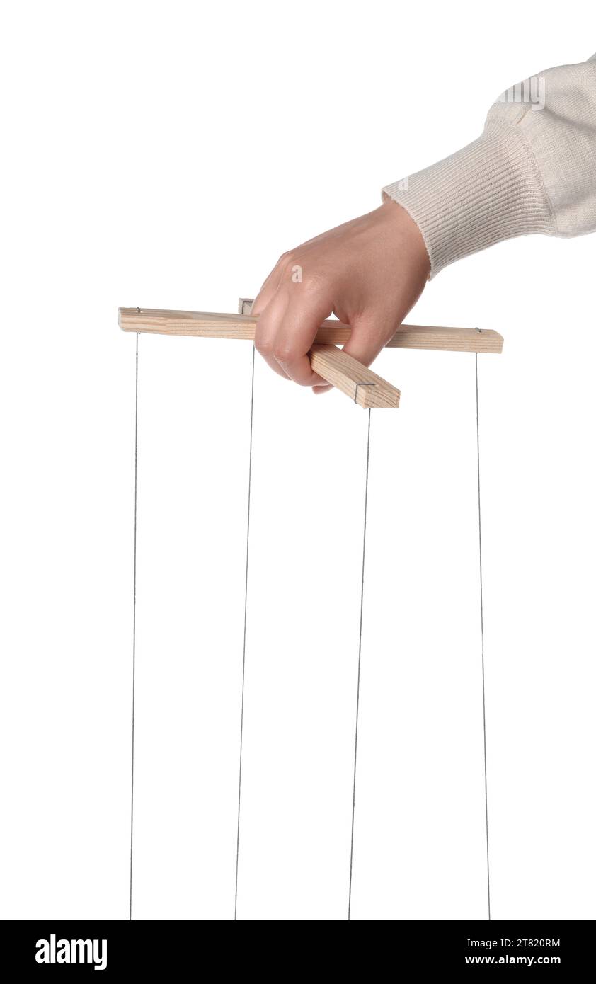 Woman pulling strings of puppet on white background, closeup Stock ...