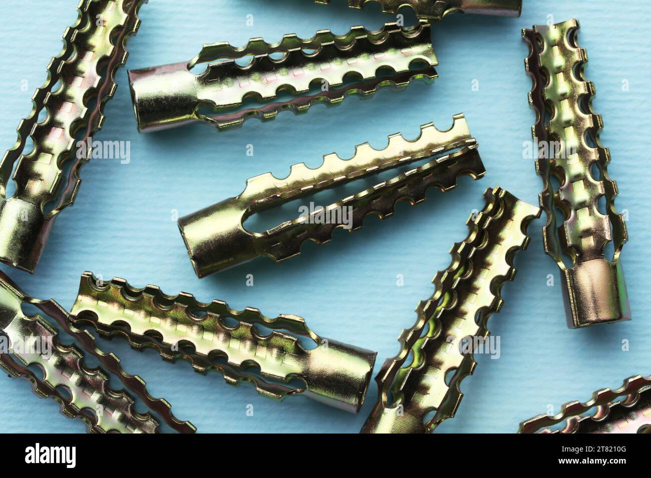 Metal dowels on light blue background, flat lay Stock Photo - Alamy