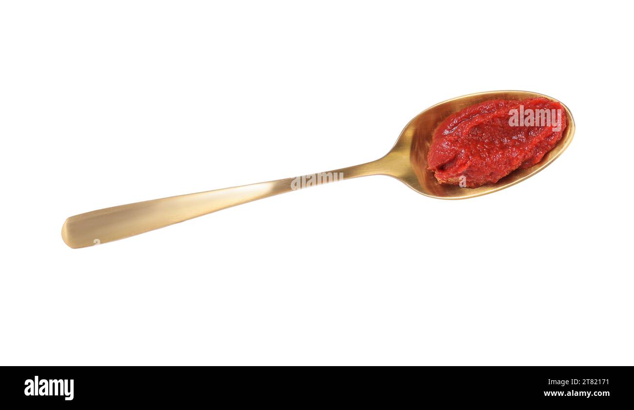 Spoon of tasty tomato paste isolated on white, top view Stock Photo - Alamy