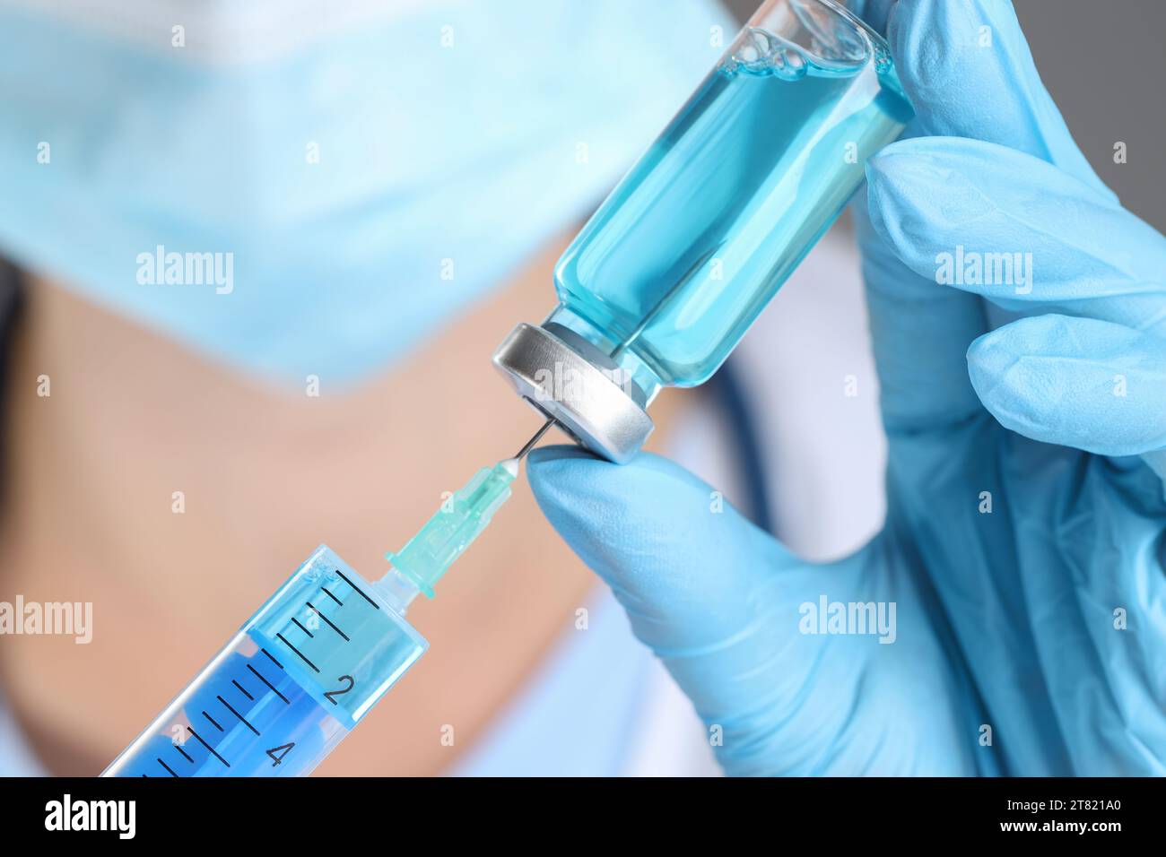 Doctor filling syringe with medication from glass vial, closeup Stock ...