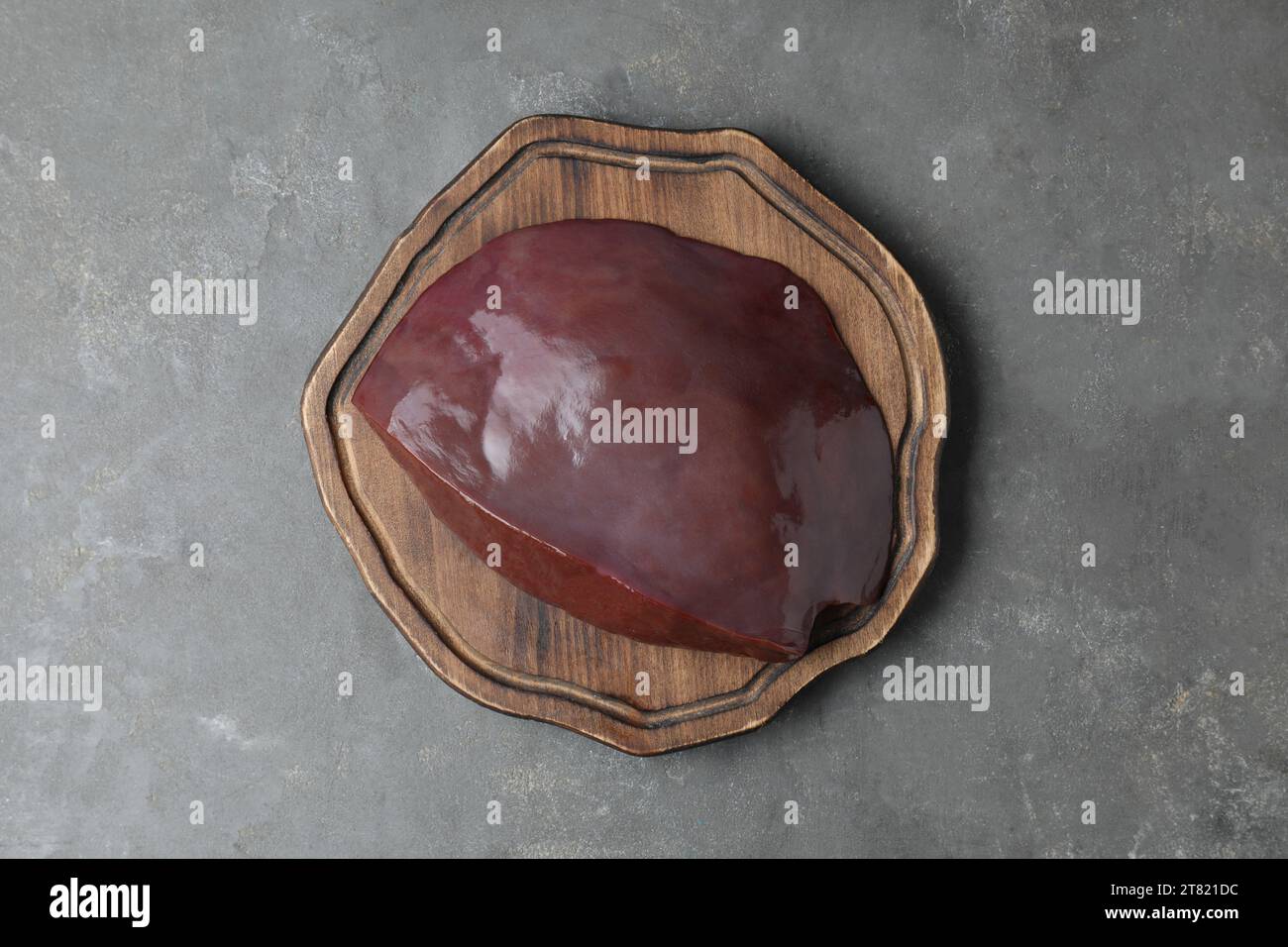 Piece of raw beef liver on grey table, top view Stock Photo - Alamy