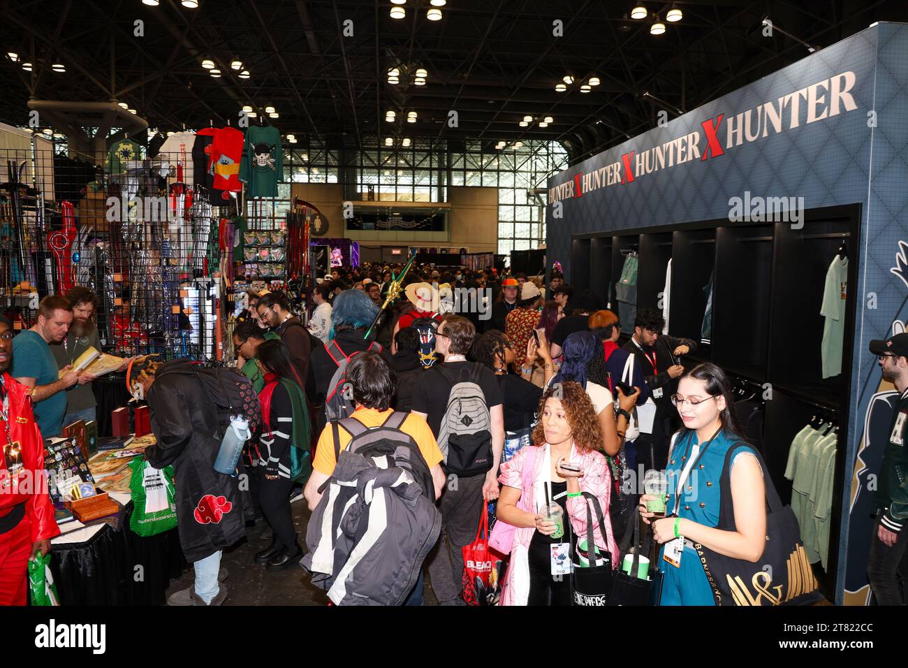 People browse the Anime NYC exhibition hall at the Jacob Javits Center ...