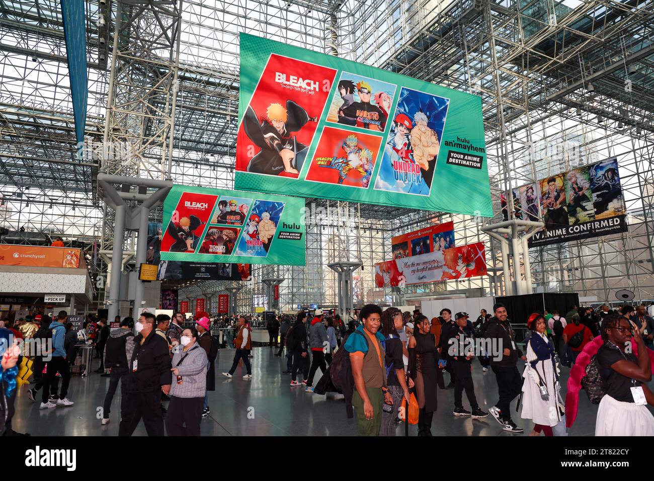 People attend the Anime NYC exhibition hall at the Jacob Javits Center ...