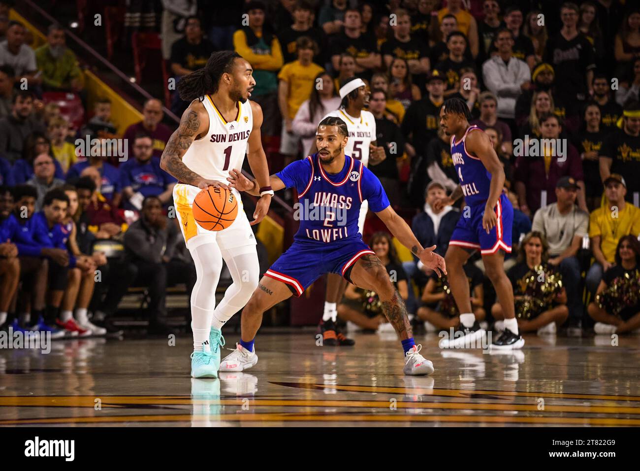 UMass Lowell River Hawks guard Ayinde Hikim (2) defends Arizona State ...