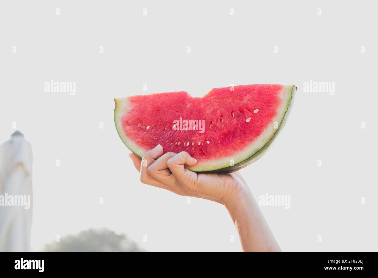 fresh Watermelon slice on a beach Stock Photo - Alamy