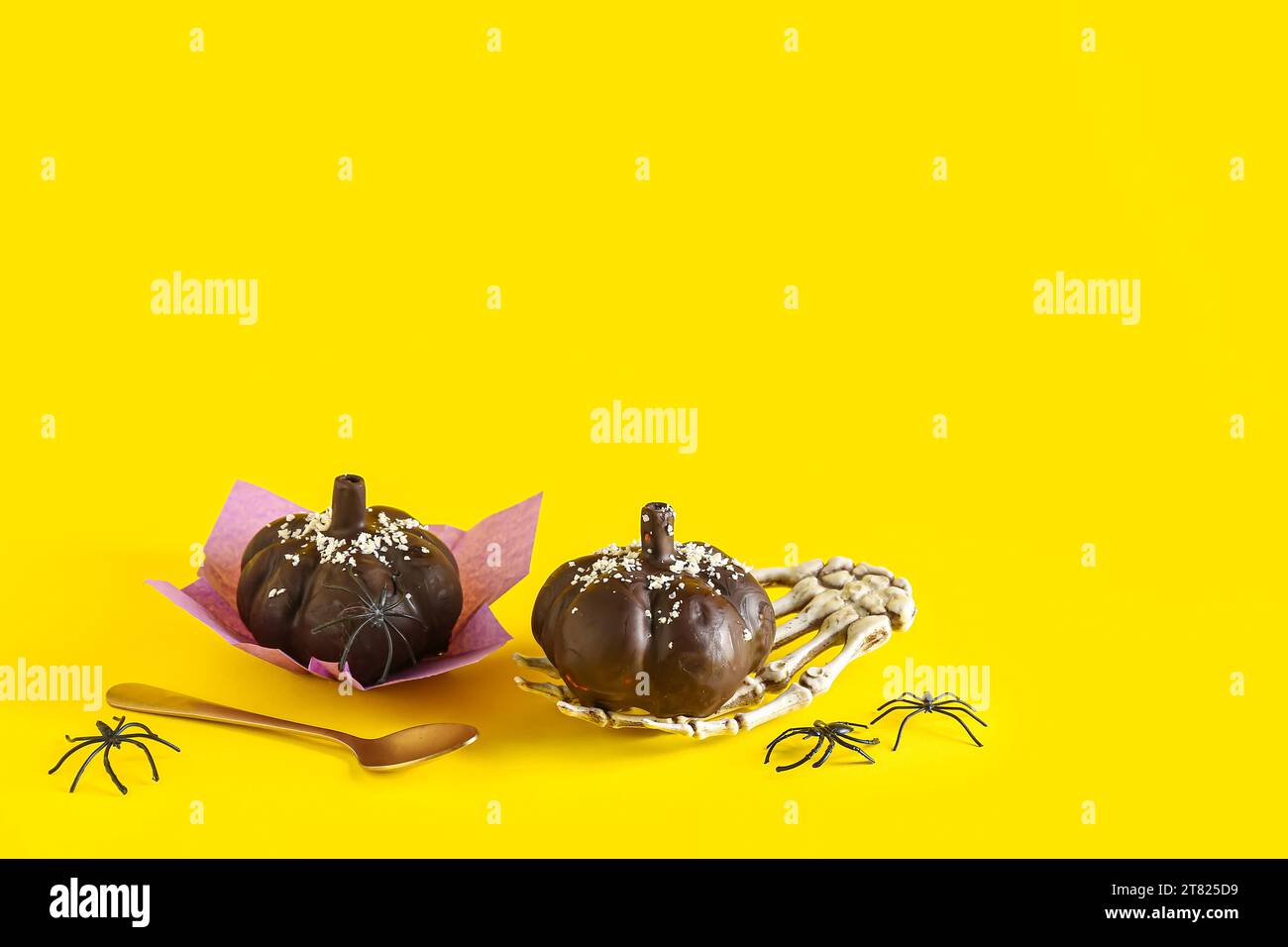 Delicious chocolate cakes, skeleton hand and spoon for Halloween ...