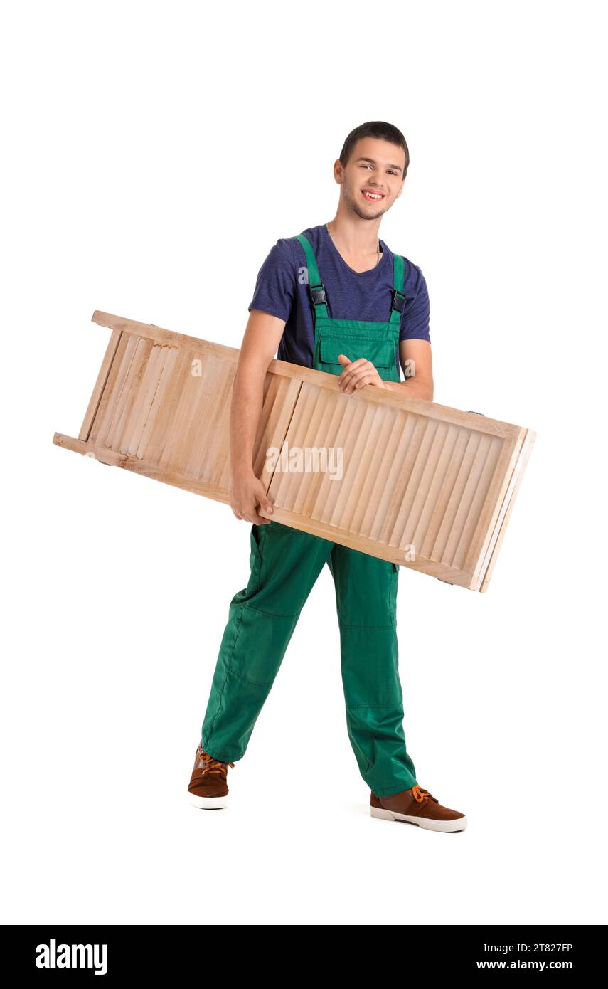 Young loader carrying folding screen on white background Stock Photo ...
