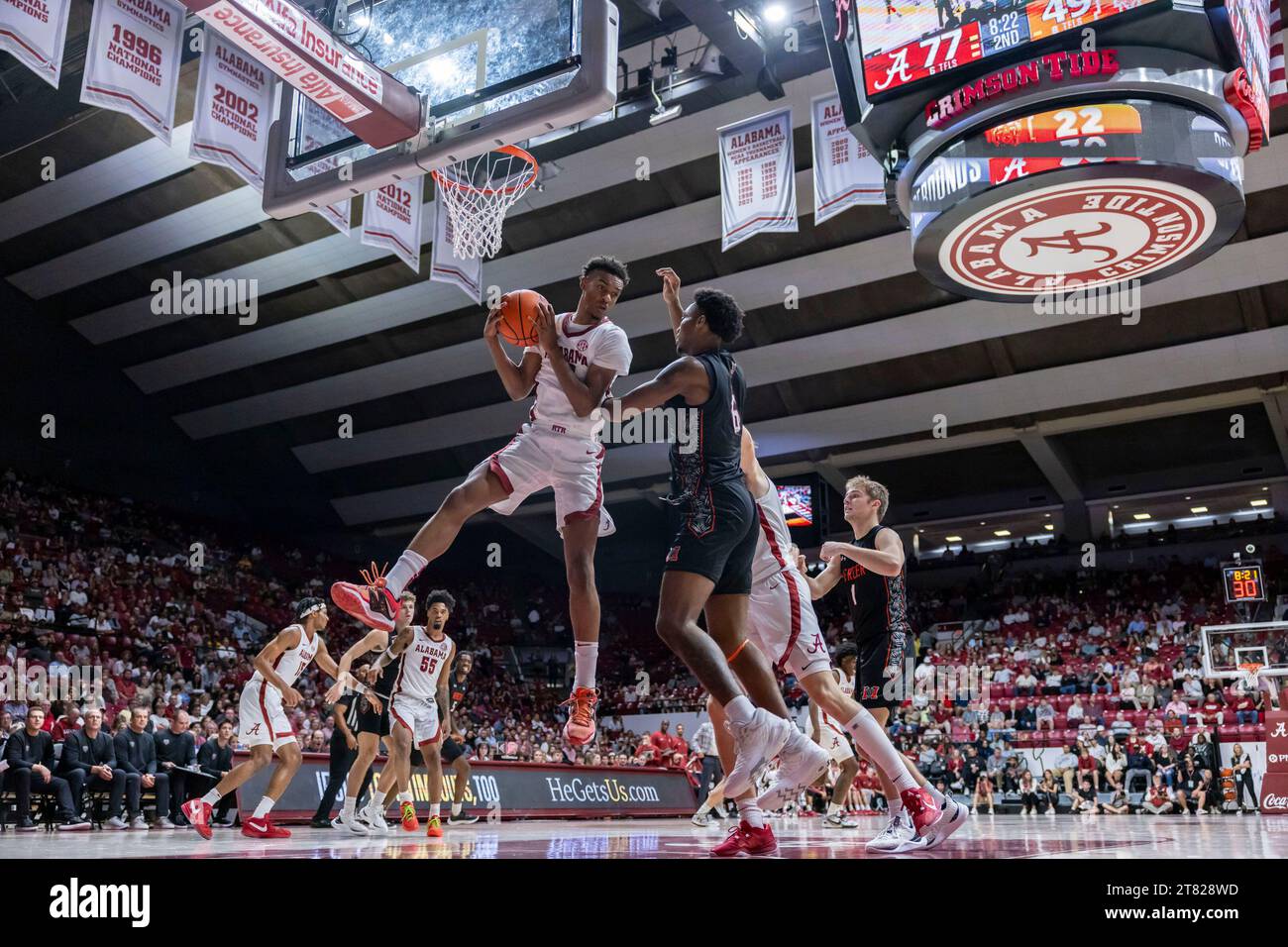 Alabama guard Rylan Griffen (3) grabs a rebound over Mercer forward ...