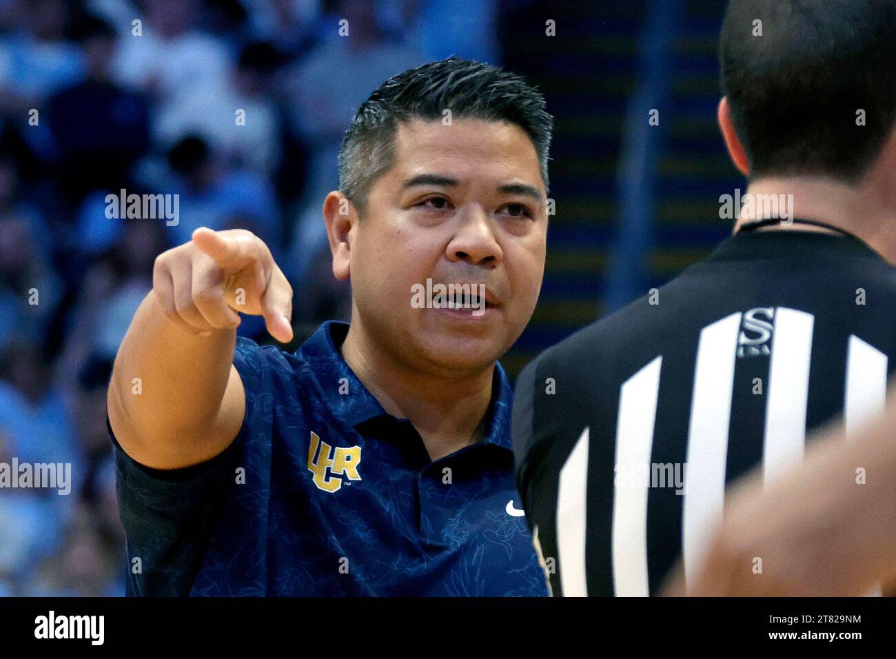 UC Riverside head coach Mike Magpayo, left, discuses a call with an ...