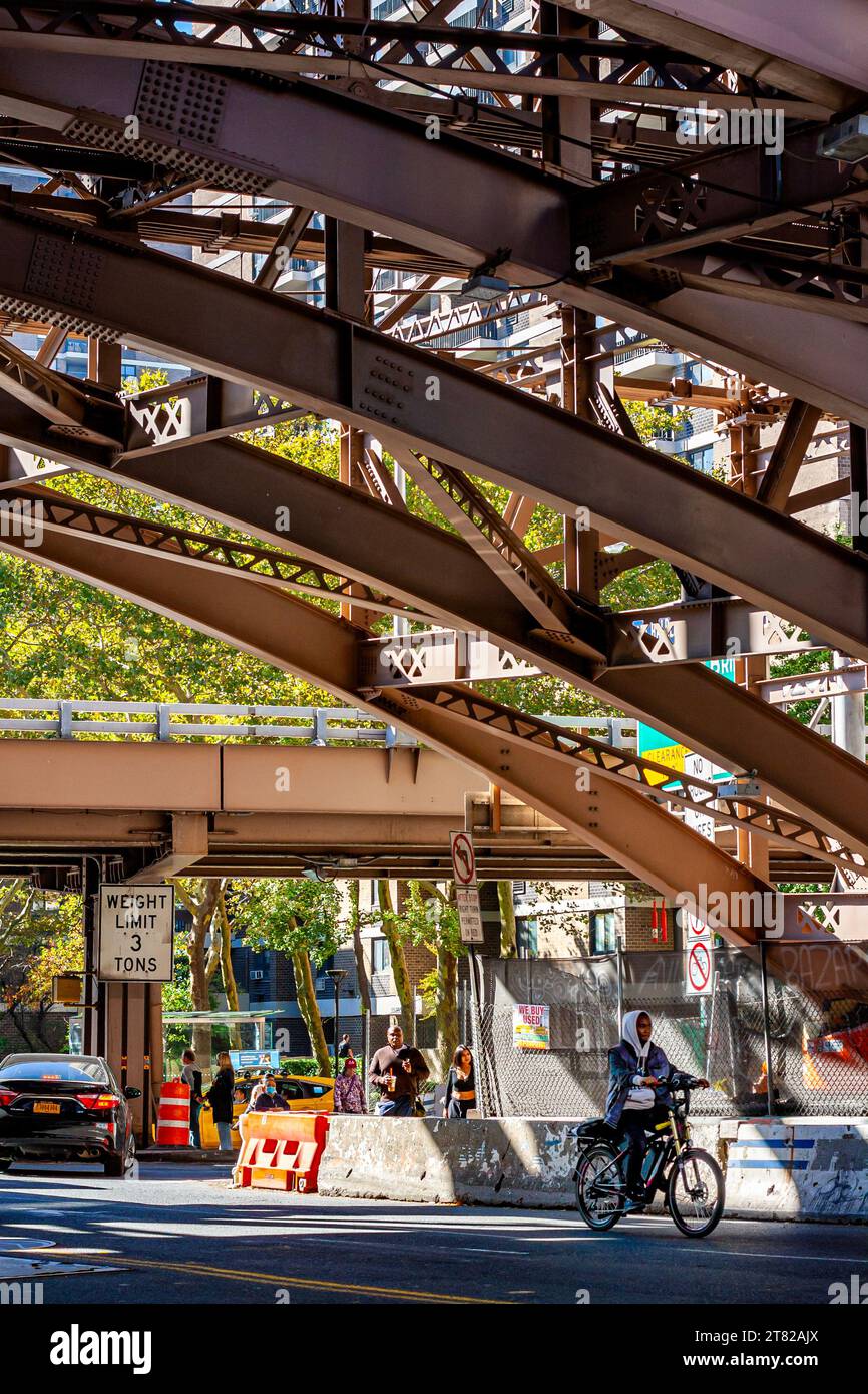 People walking under the Brooklyn Bridge in Manhattan, New York City ...
