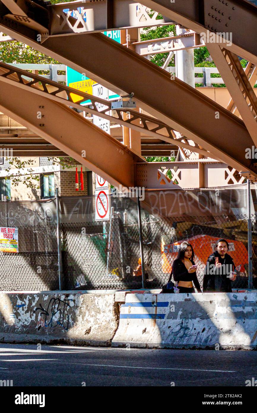 People walking under the Brooklyn Bridge in Manhattan, New York City ...