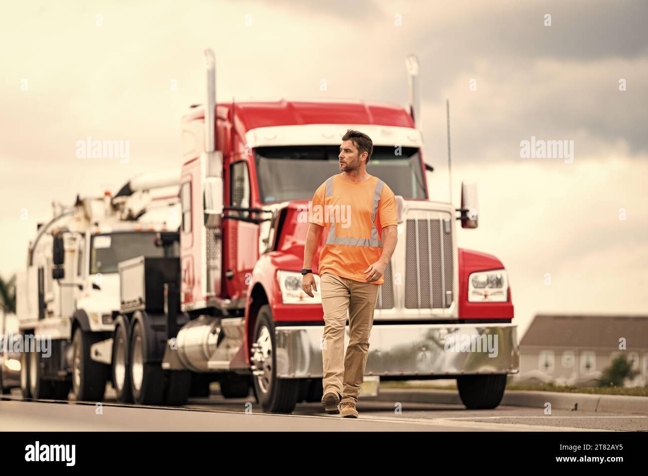 Highway engineer walking on highway. Man wearing safety vest for ...