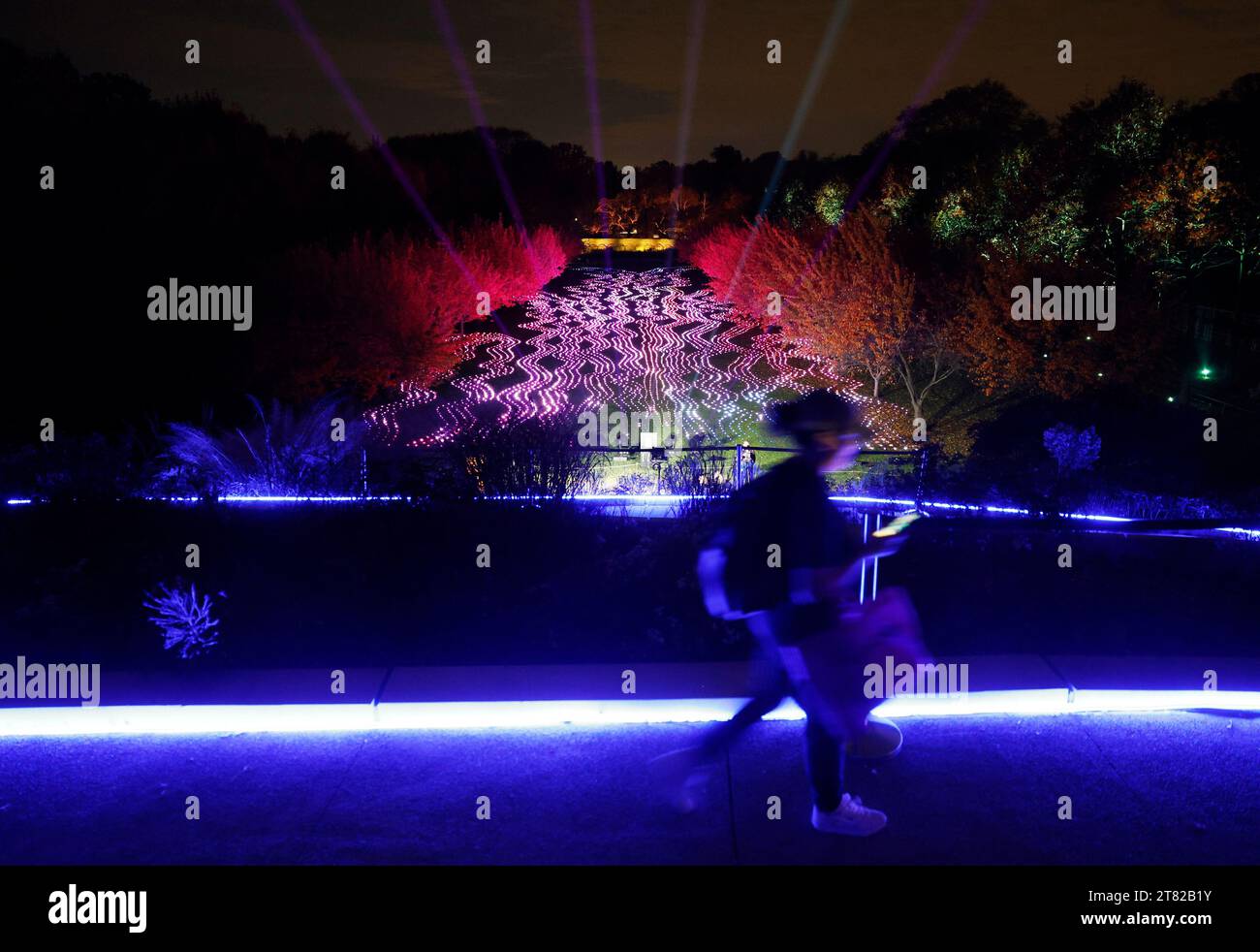 People tour the holiday light installations at Lightscape, an after ...