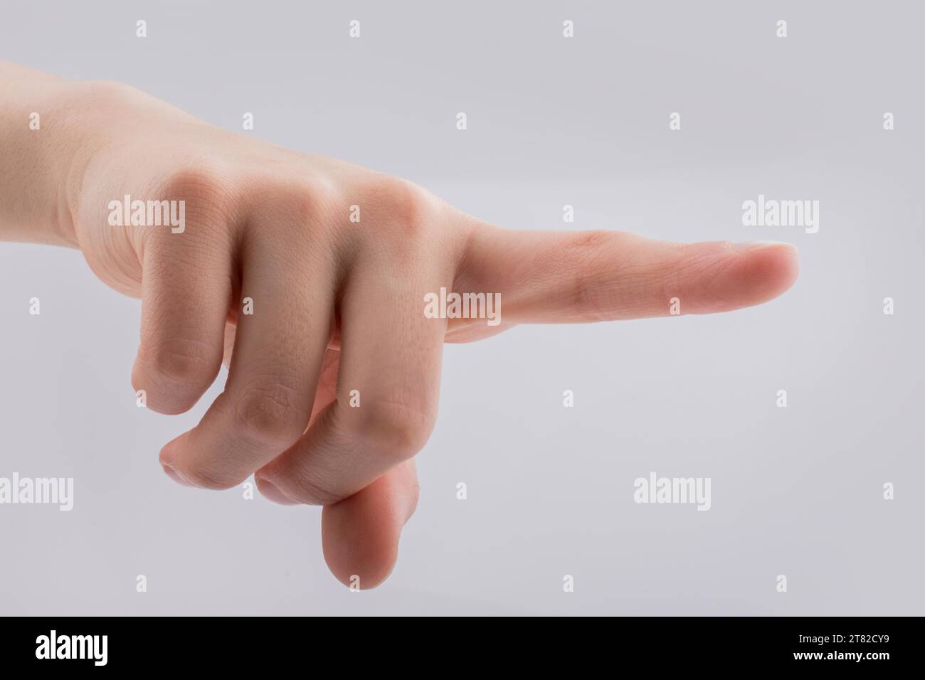 Hand pointing gesture on a white background Stock Photo - Alamy