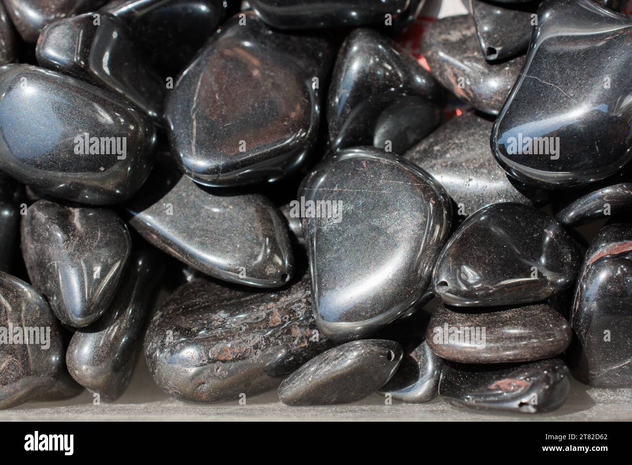 Shiny metallic gray tumbled hematite gemstone as mineral rock Stock ...