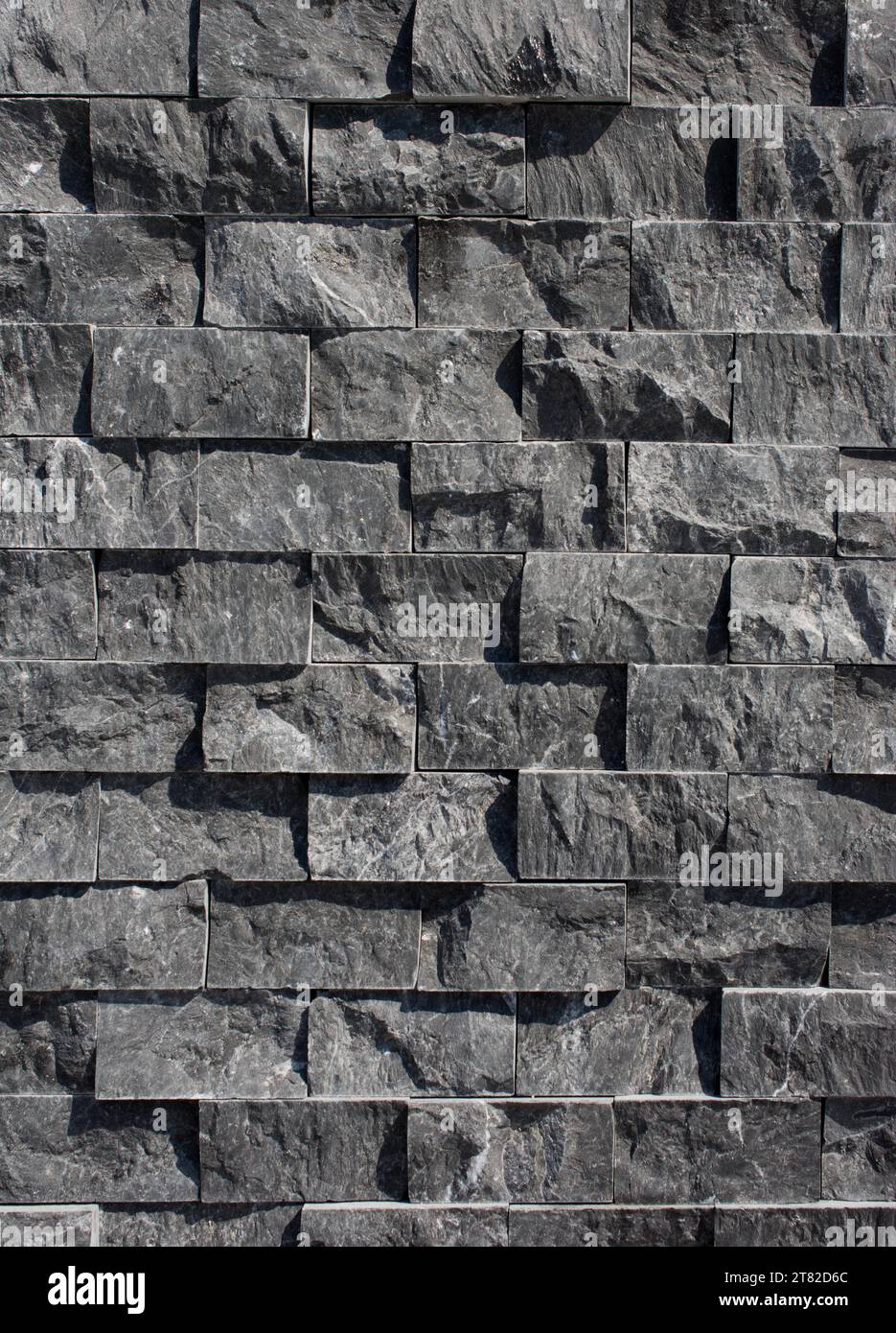 Decorative cubic stone wall as background texture Stock Photo - Alamy