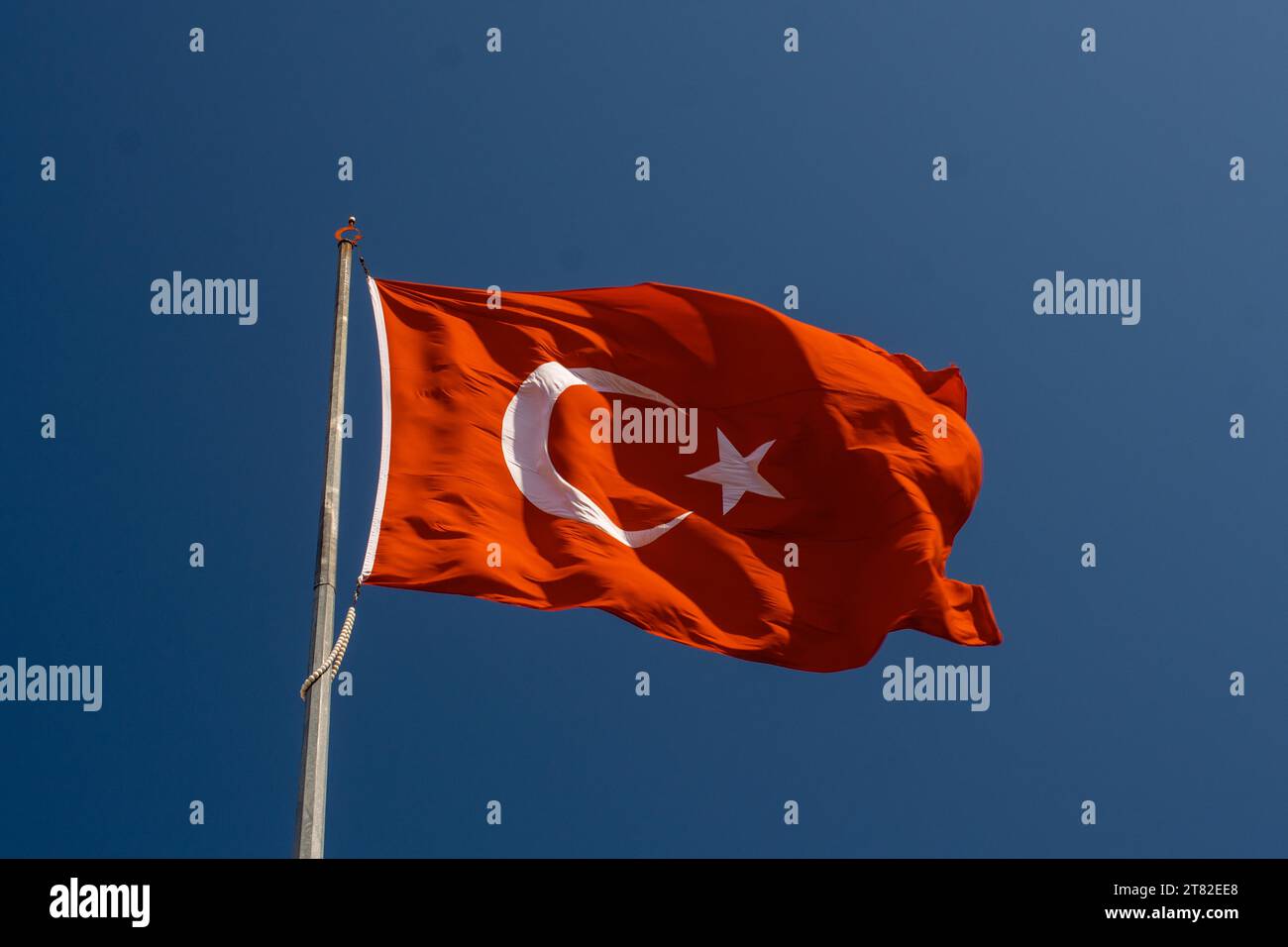 Turkish national flag with white star and moon on a pole in sky Stock ...