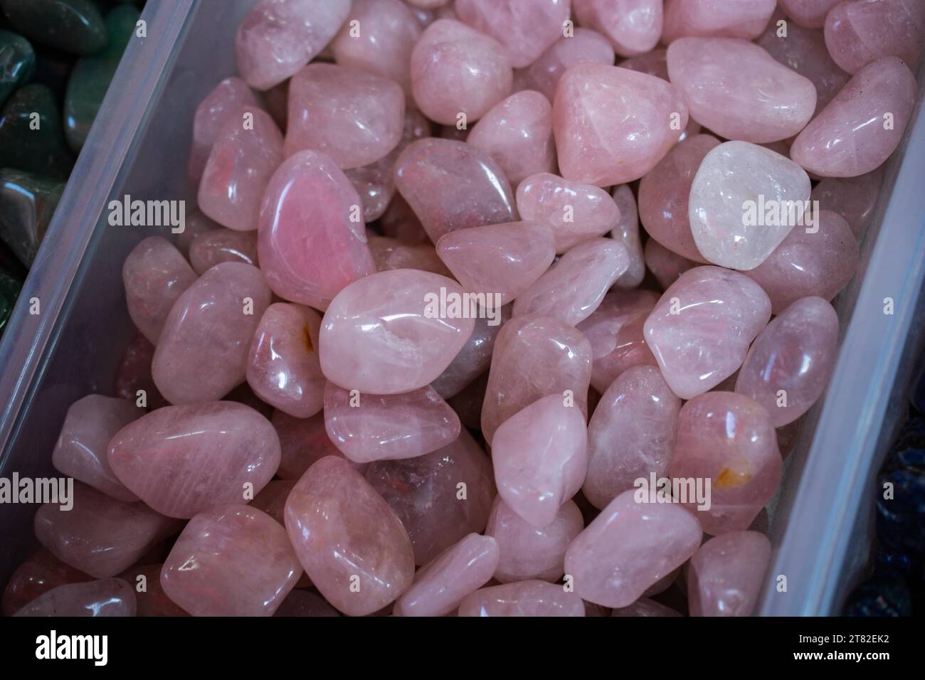 Tumbled Rose Quartz gem stone as mineral rock specimen Stock Photo - Alamy