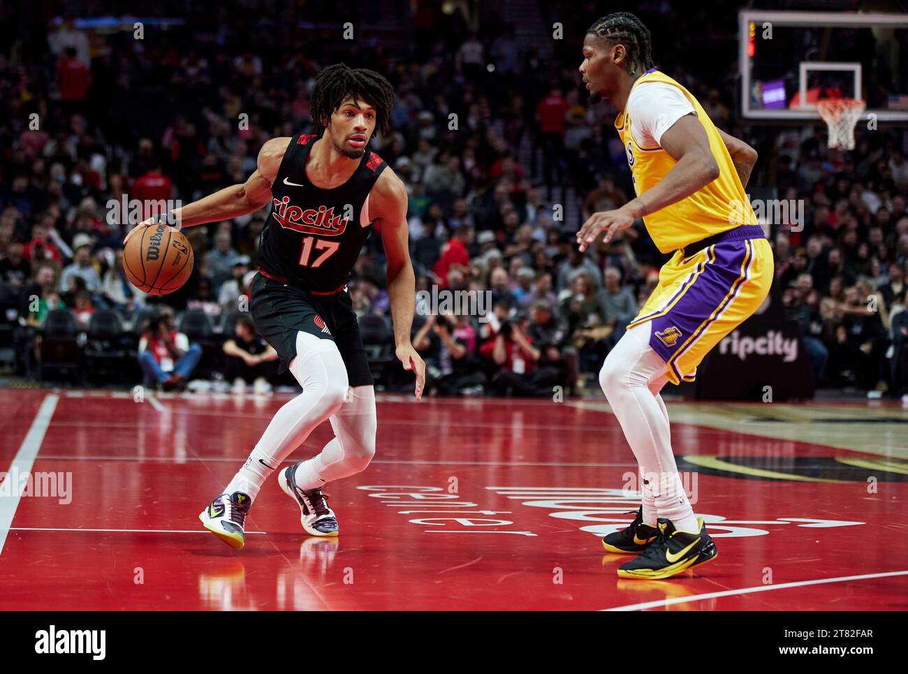 Portland Trail Blazers guard Shaedon Sharpe, left, is defended by Los ...