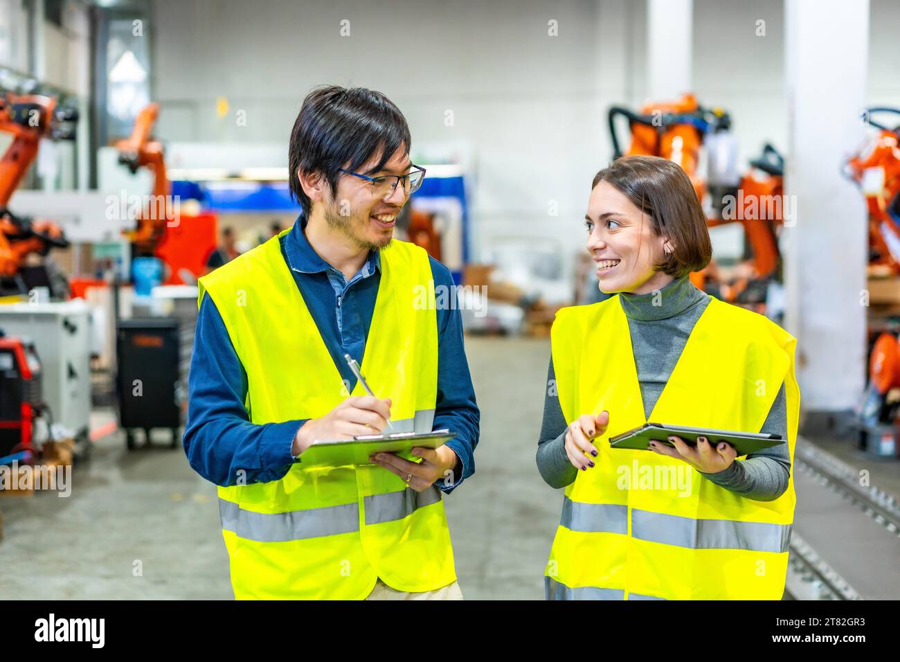 Woman engineers control robotic arm hi-res stock photography and images ...