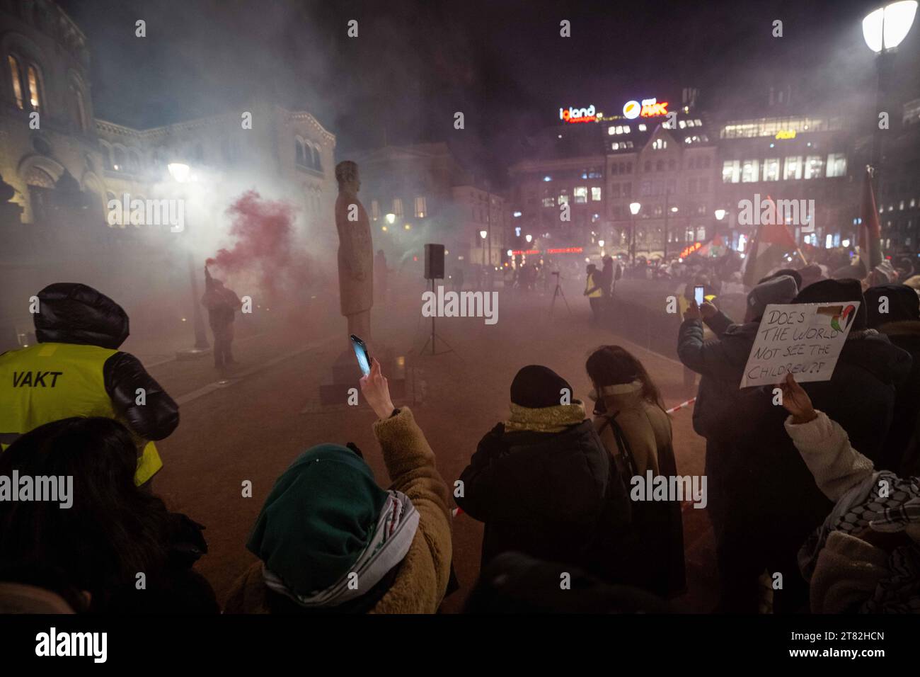 Oslo, Norway. 17th Nov, 2023. Several activists are seen lighting smoke ...