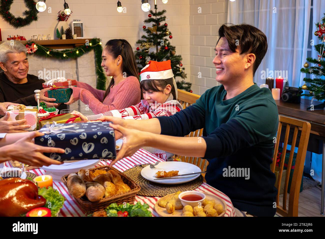 Happy people are celebrating on a table meal when christmas and new ...