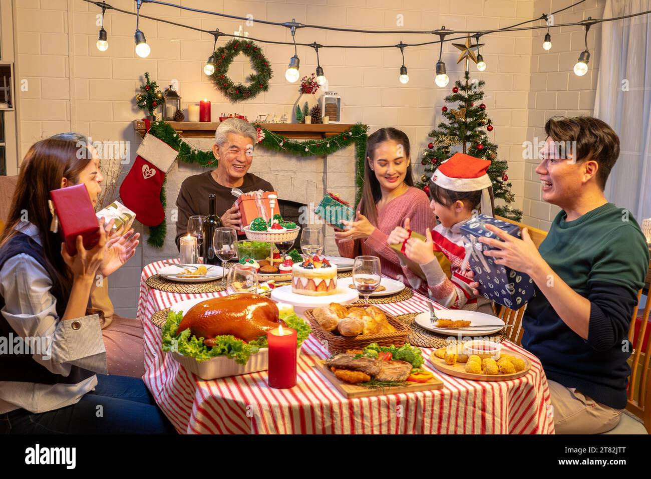Happy people are celebrating on a table meal when christmas and new ...
