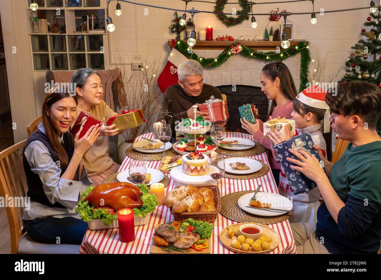 Happy people are celebrating on a table meal when christmas and new ...