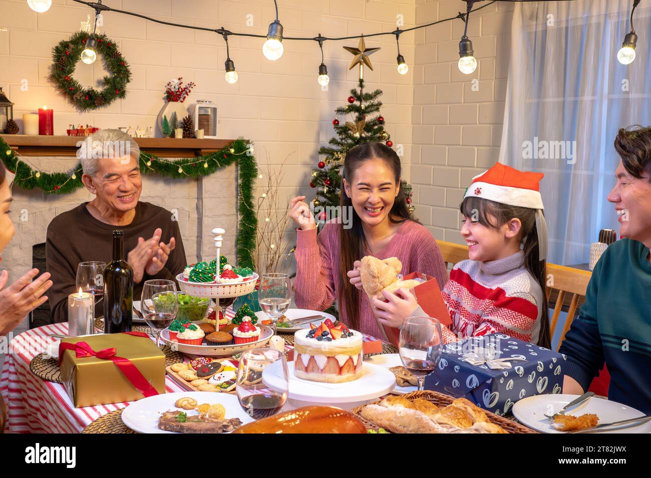 Happy people are celebrating on a table meal when christmas and new ...