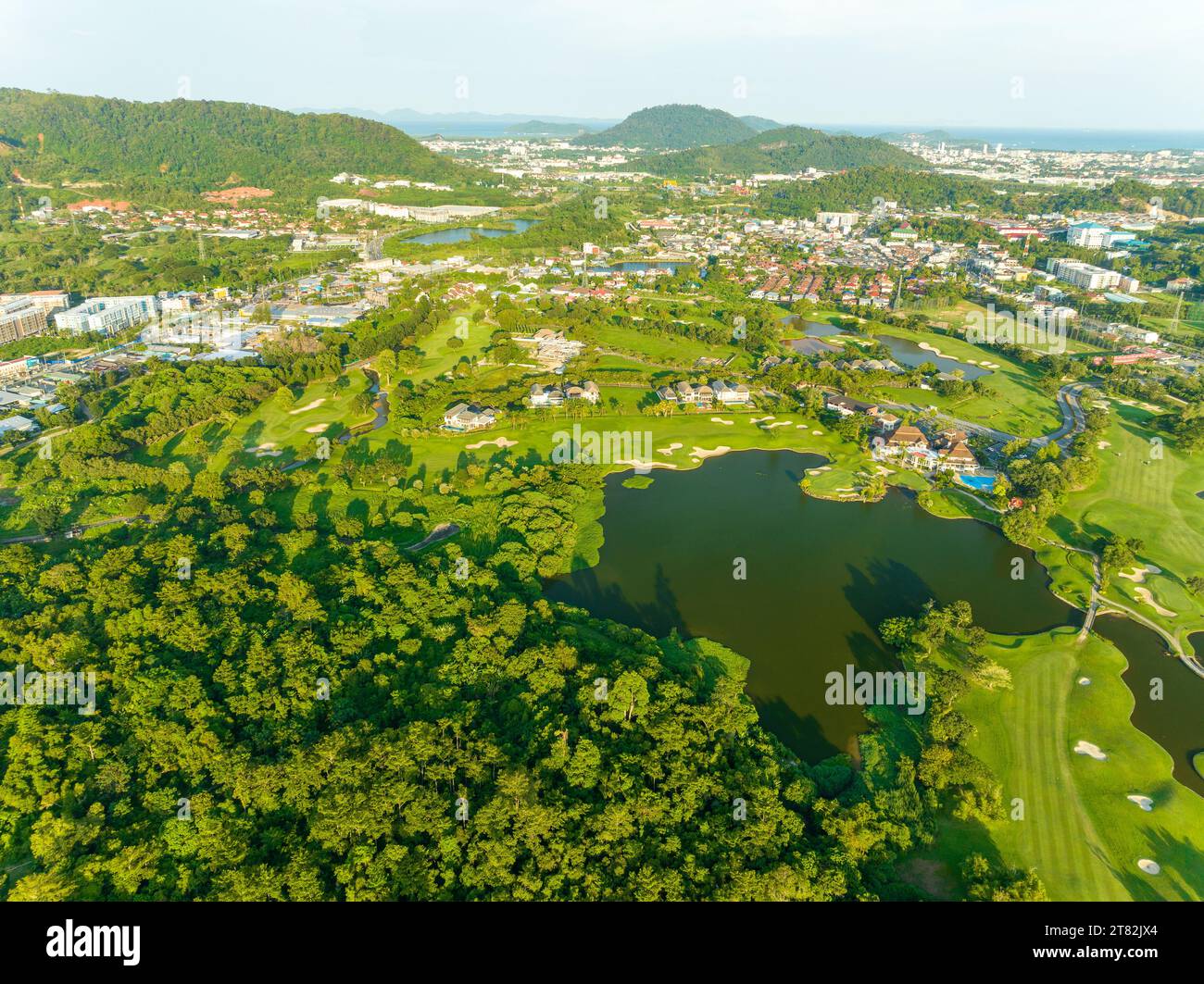 Aerial view of beautiful green golf field fairway and putting green ...