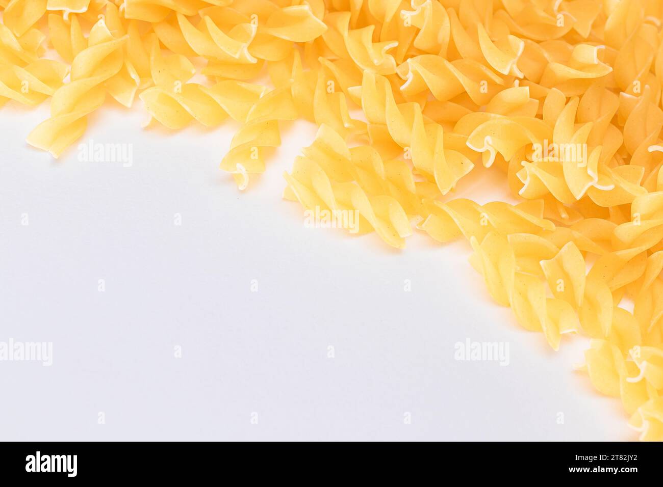 Uncooked Fusilli Pasta with Copy Space on White Background. Raw and Dry ...