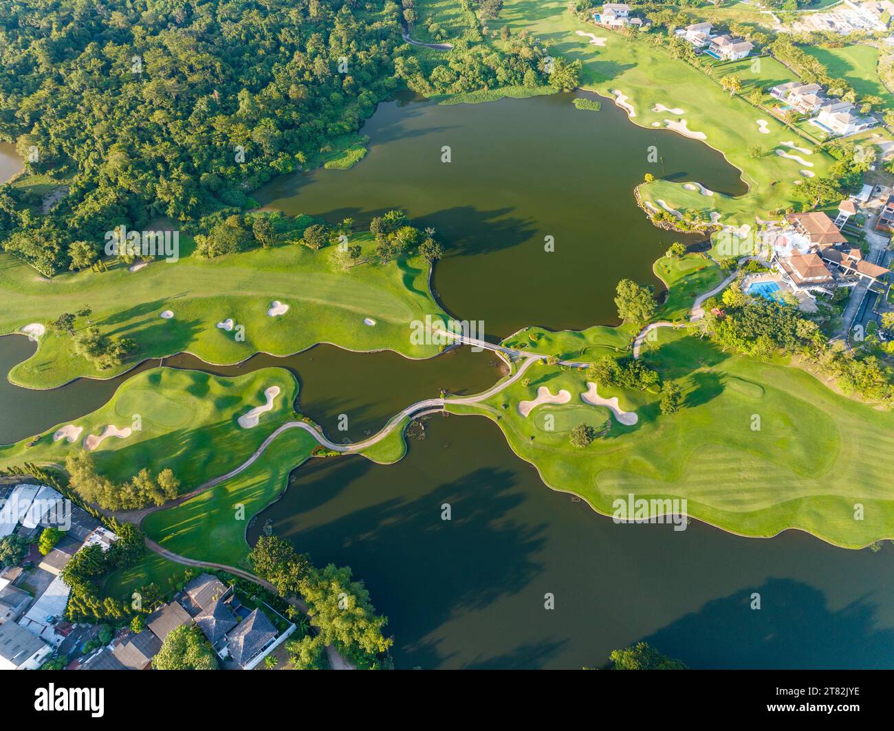 Aerial view of beautiful green golf field fairway and putting green ...