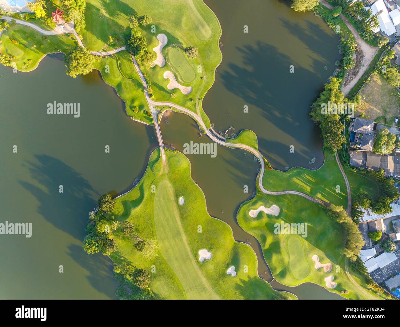 Aerial view of beautiful green golf field fairway and putting green ...