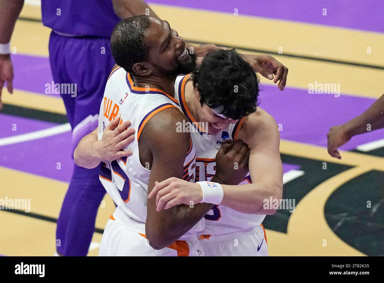 Phoenix Suns forward Kevin Durant, left, celebrates with forward Yuta ...