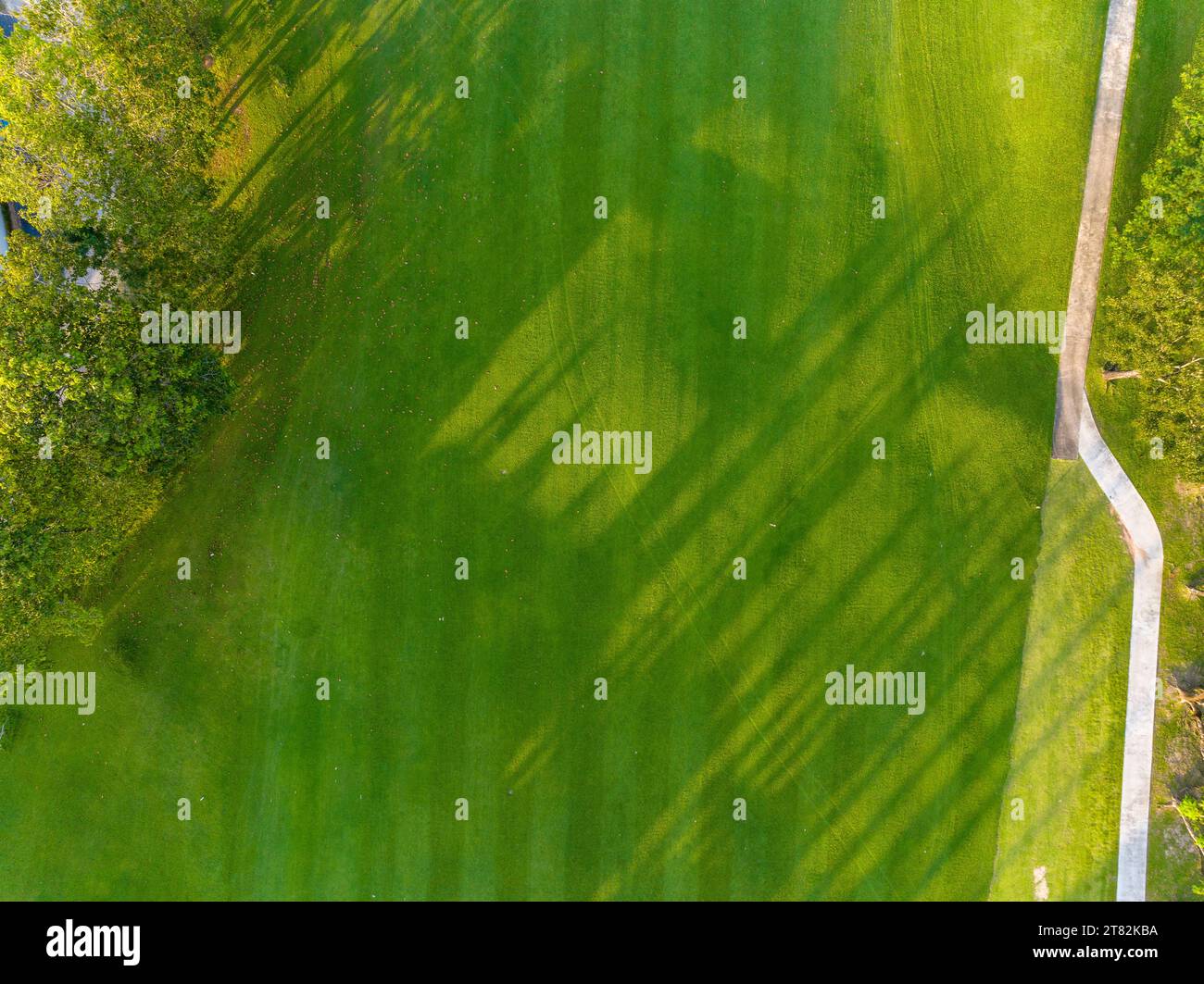 Aerial view of beautiful green golf field fairway and putting green ...