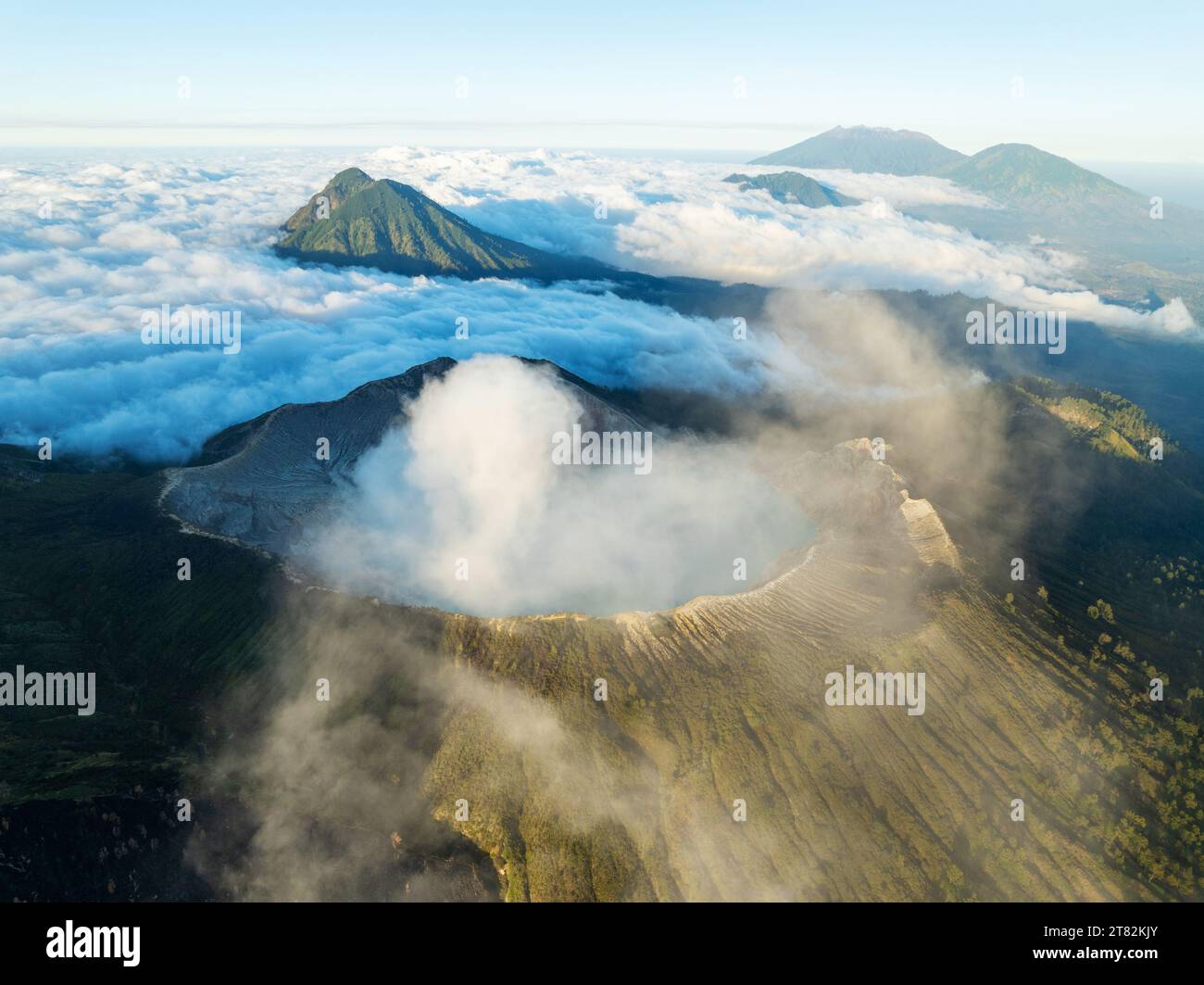 Aerial view of rock cliff at Kawah Ijen volcano with turquoise sulfur ...