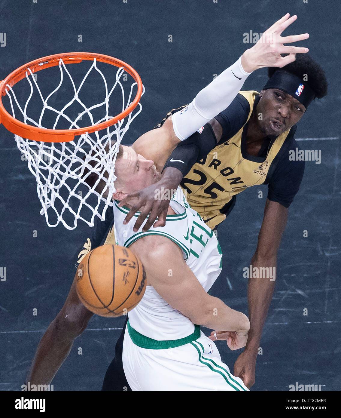 Toronto, Canada. 17th Nov, 2023. Kristaps Porzingis (L) of Boston Celtics interferes with a dunk ...