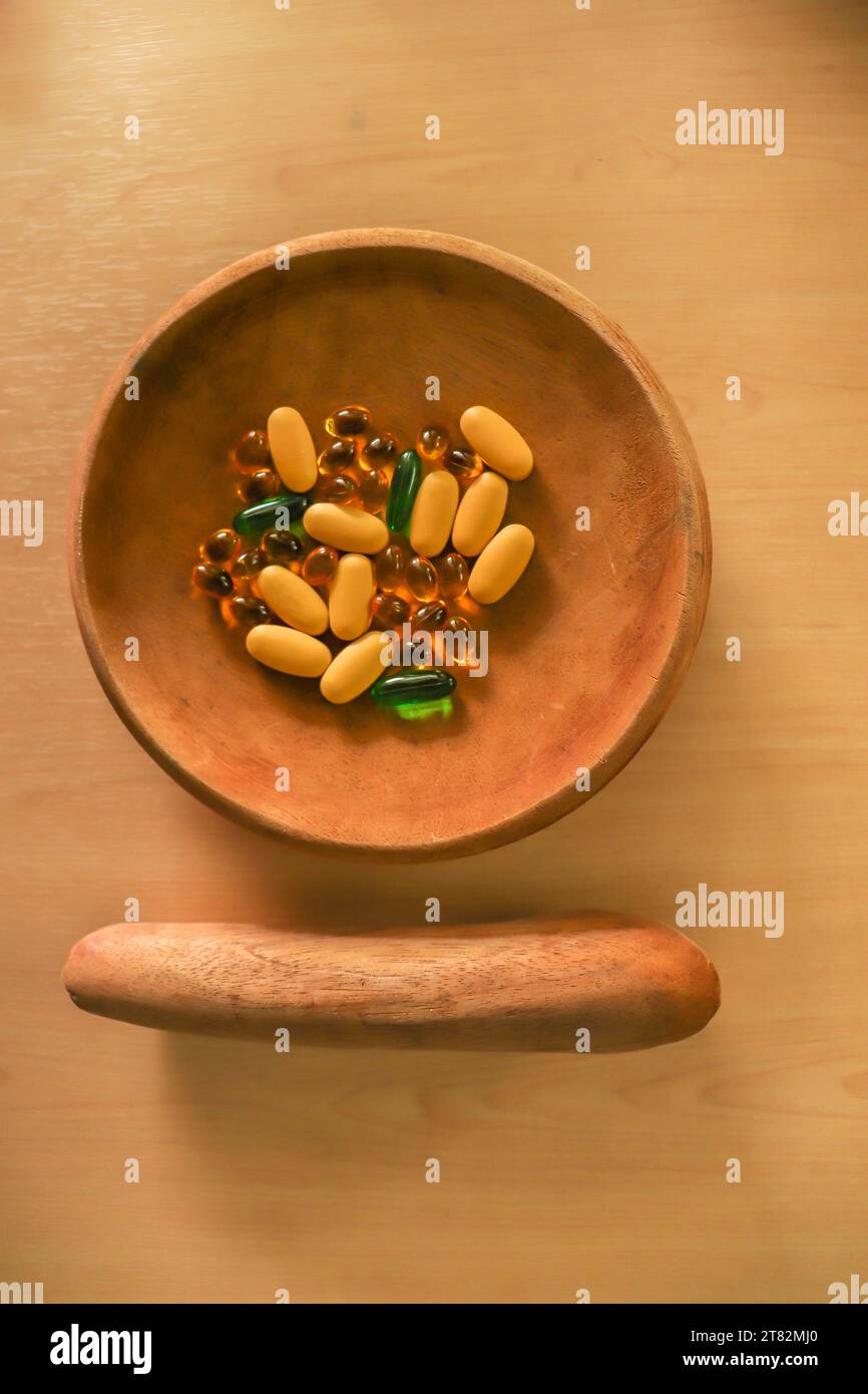 Vitamins and Medicine Tablets and Capsule on a Clay Plate with the ...