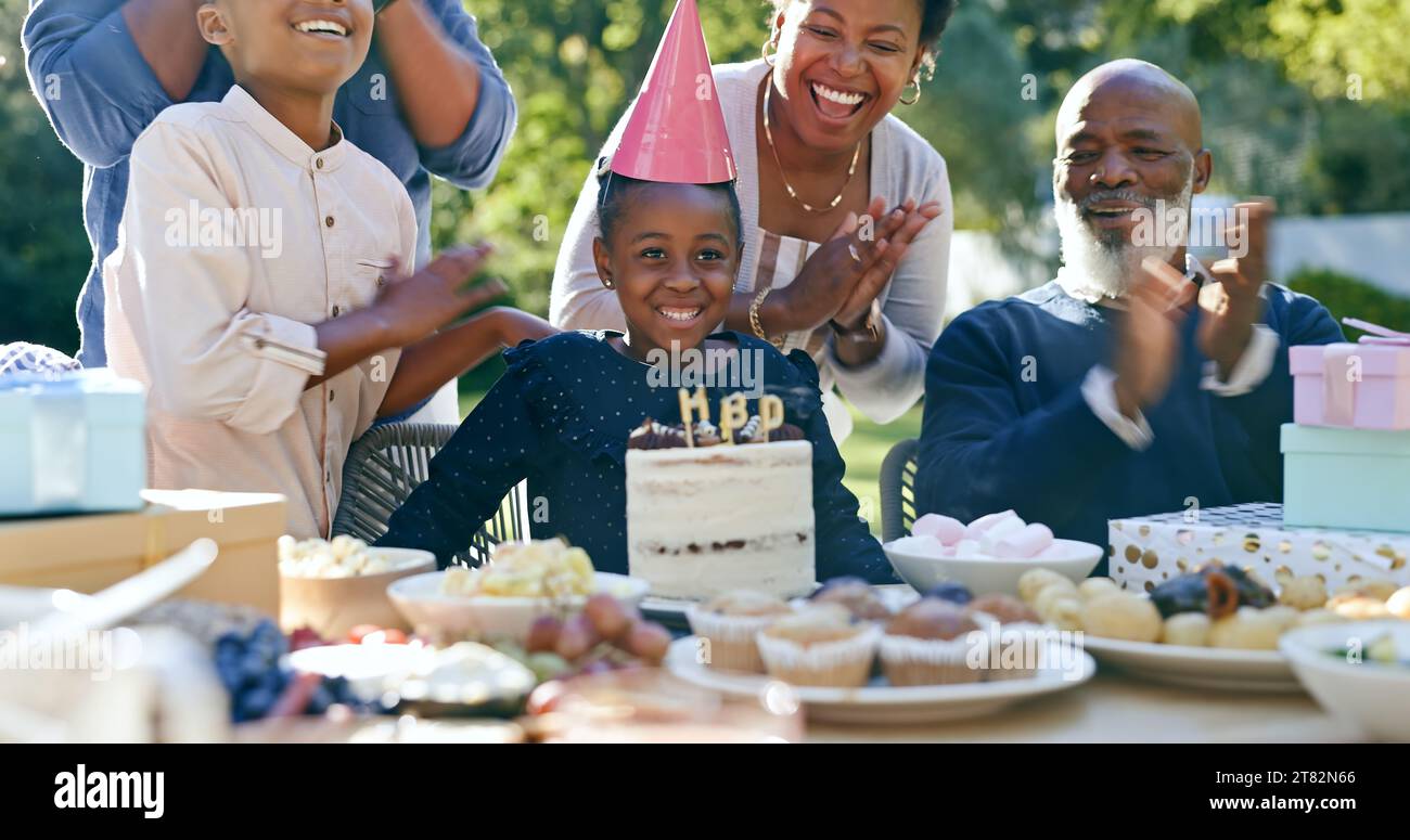 Family, birthday and applause at party with cake, celebration and ...