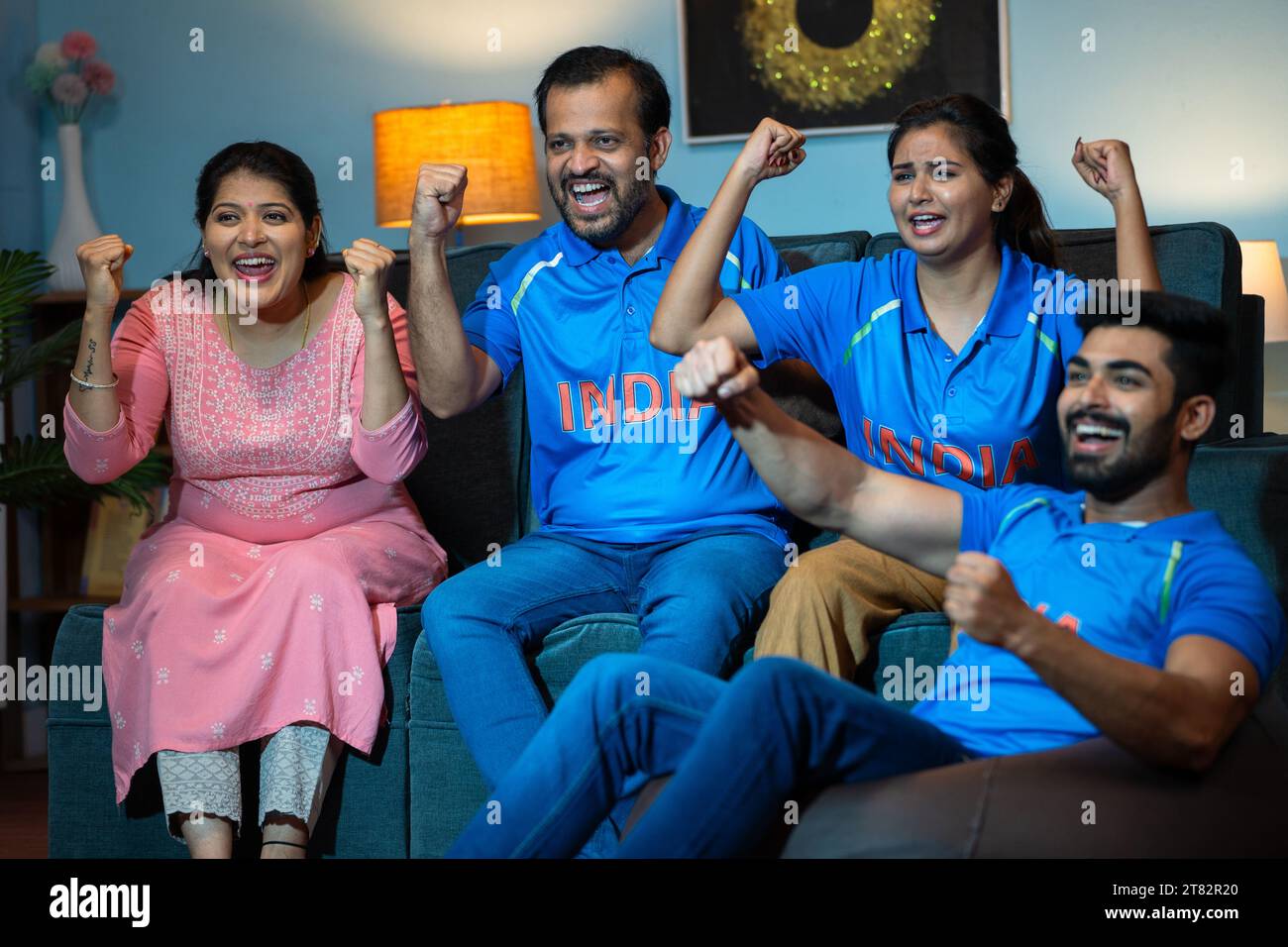 Happy Siblings talking with single middle aged mother at home - concept ...