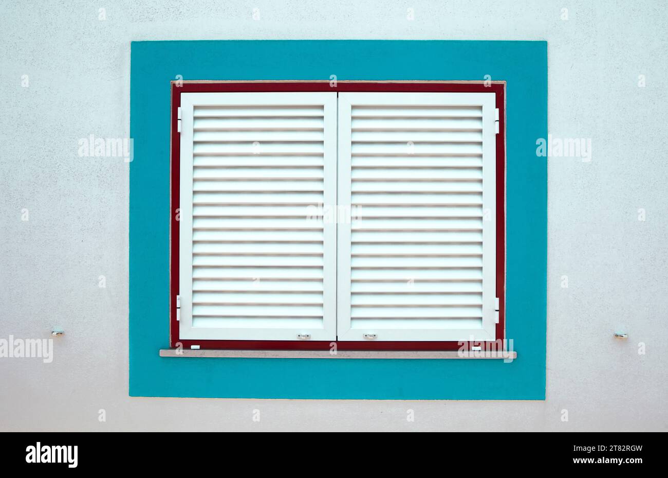 Tiny window painted with vivid colors at Vila Nova de Milfontes house ...