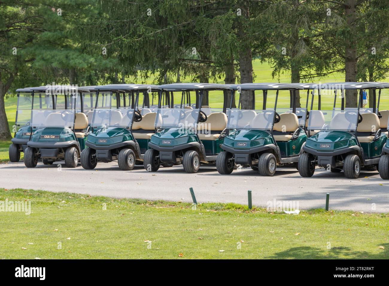 Row of Club green golf carts, with no people. Taken at a country club ...