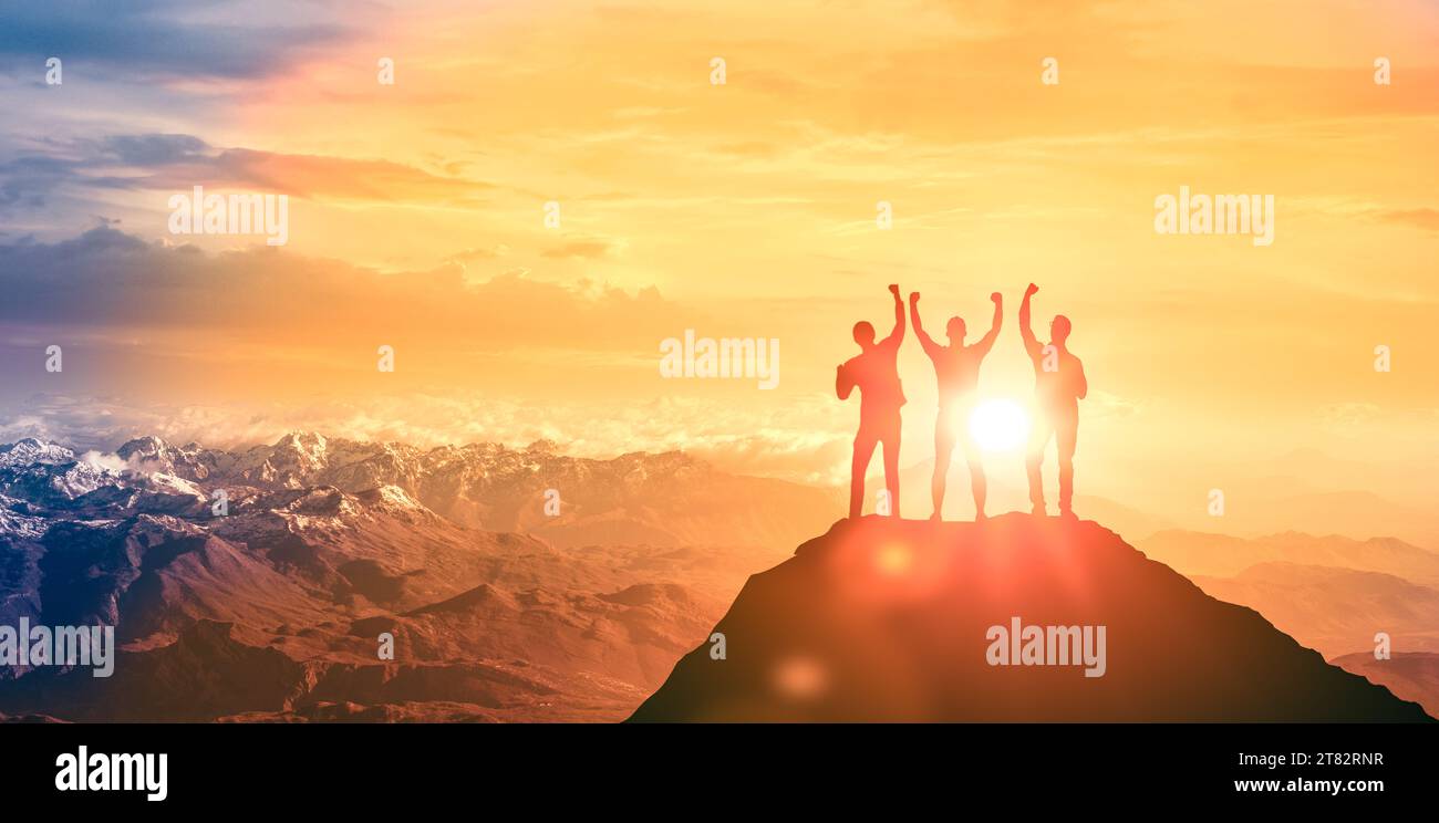 Silhouette Team of climbers man on mountain top. successful teamwork in ...