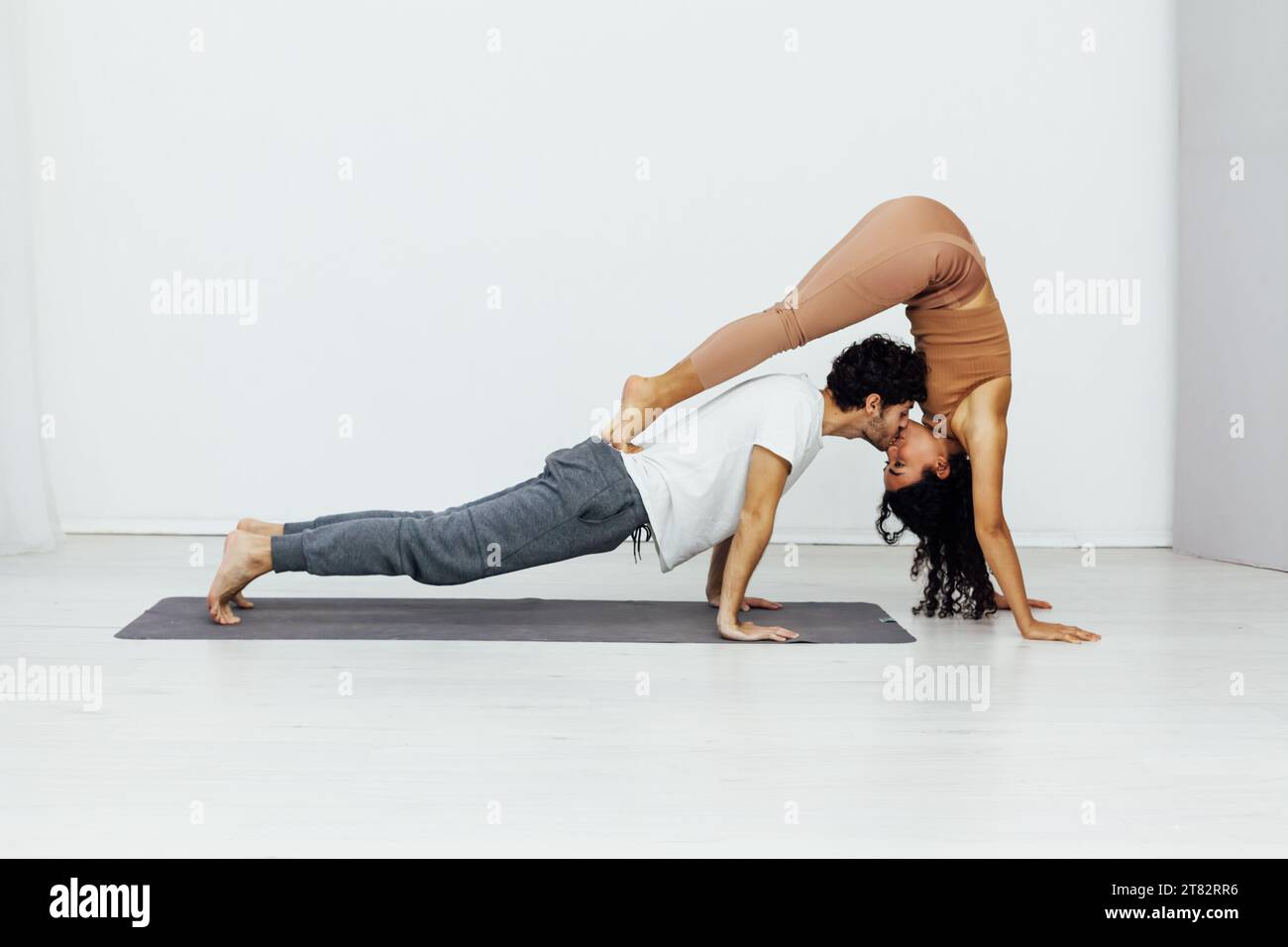 woman and man practice yoga lotus pose stretching healthy back asana ...