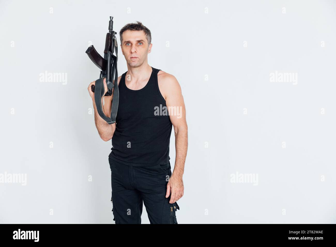 a man with a machine gun on a white background war Stock Photo - Alamy