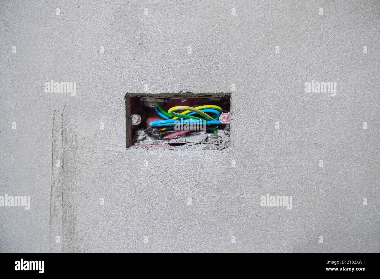 Picture of electrical hub Embedded in the concrete wall Before complete ...