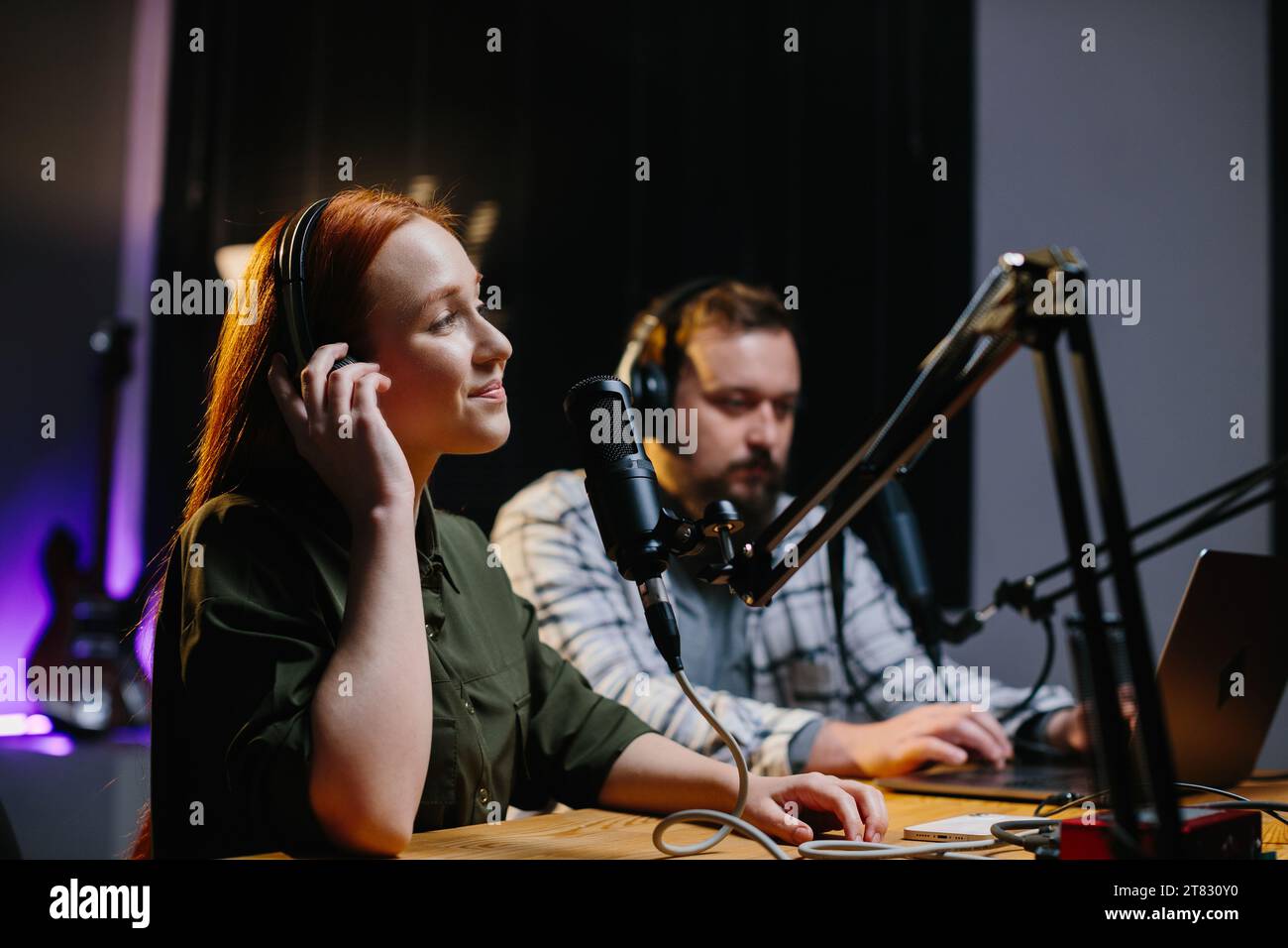 Young girl radio host live with her colleague. Hosts work on the radio ...