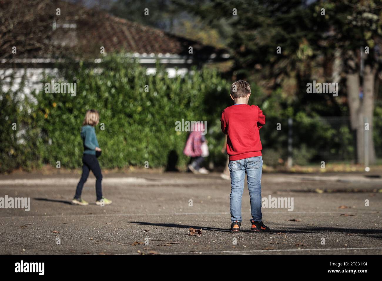 Gradignan, France. 18th Nov, 2023. A child stands alone during recess ...